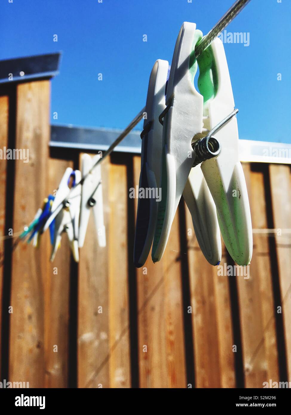 Clothesline with clothespegs Stock Photo - Alamy