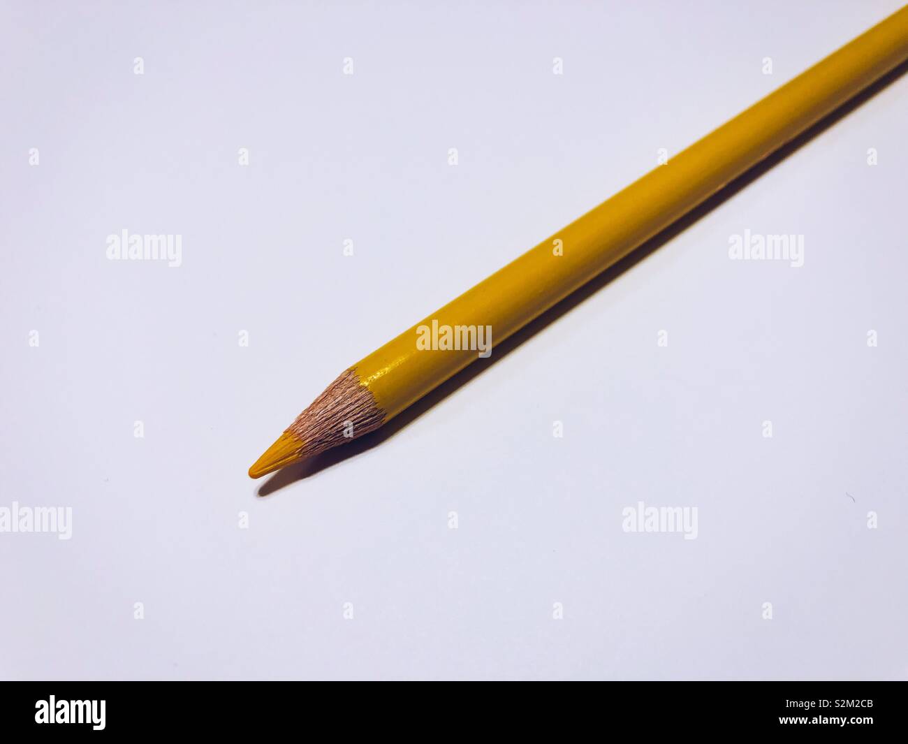 Yellow Pencil on Sparkly Paper Stock Photo - Alamy