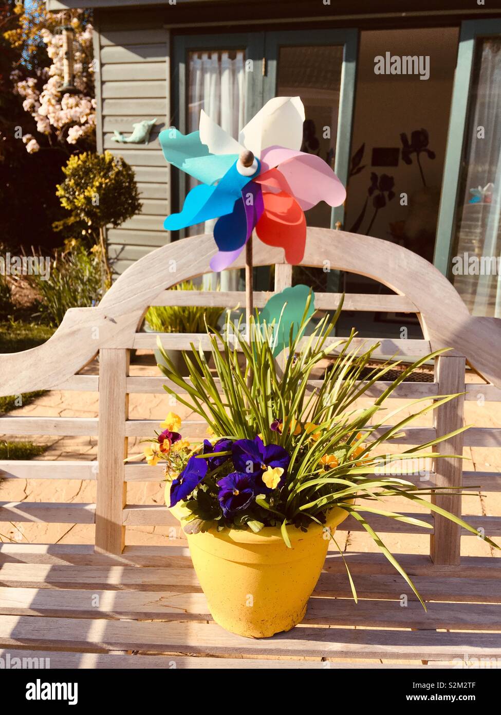 Garden windmill toy in a flower pot Stock Photo - Alamy