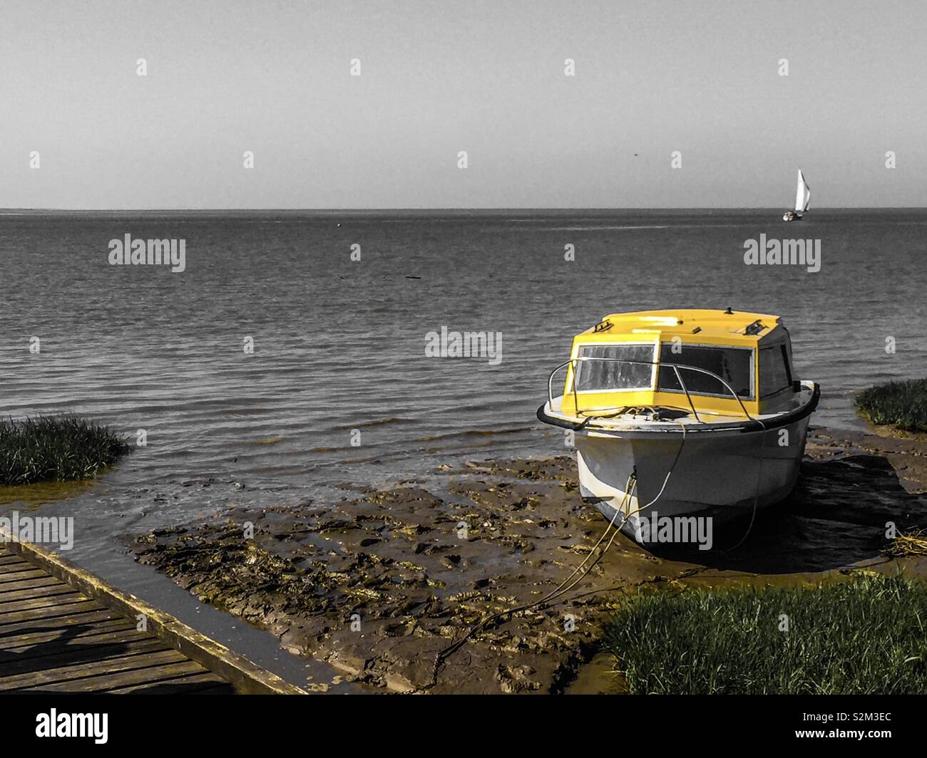 Old yellow boat on the Ribble Estuary in Lancashire, England Stock ...