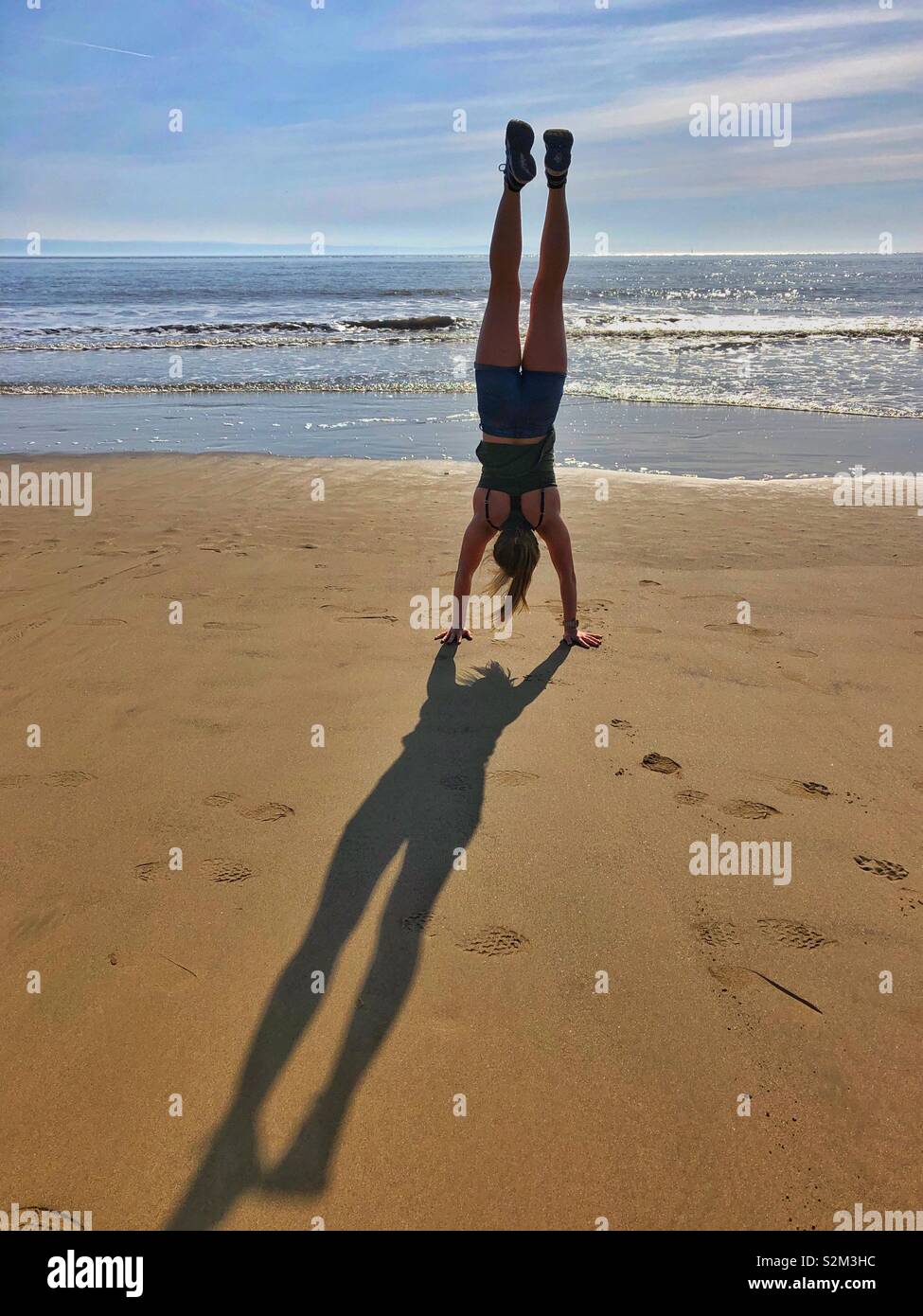 Handstand on beach hi-res stock photography and images - Alamy