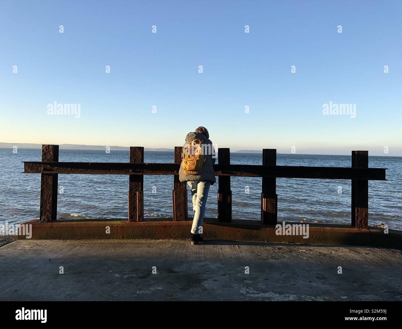 Girl looking out to sea Stock Photo - Alamy