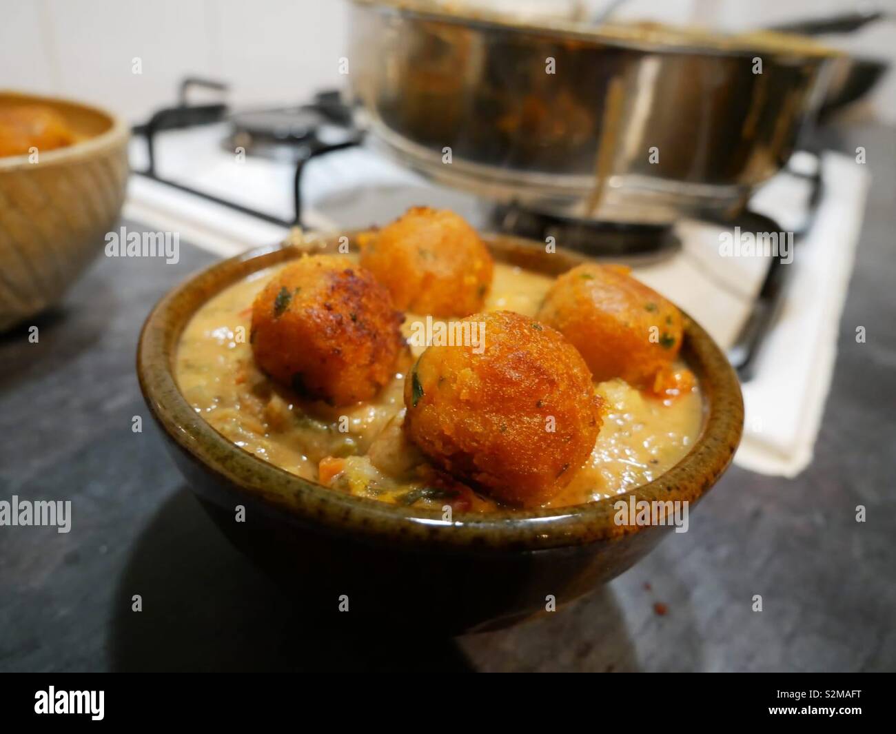 Vegan kofta with African peanut stew Stock Photo - Alamy