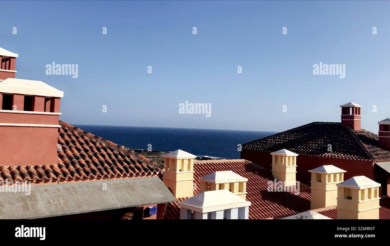 Rooftops and Sea Stock Photo - Alamy