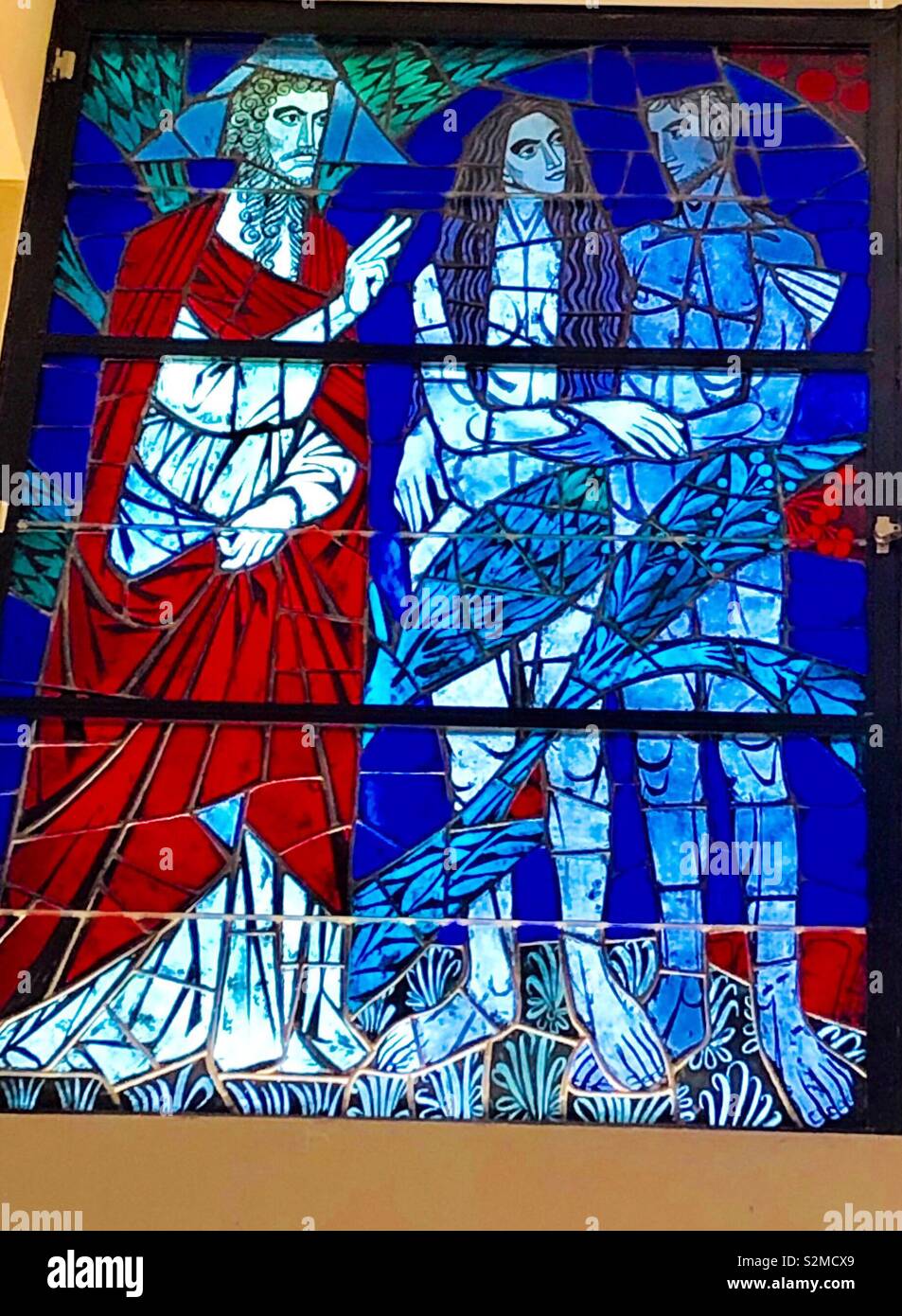 Stained Glass image of the Banishment of Adam and Eve. Taken at St ...