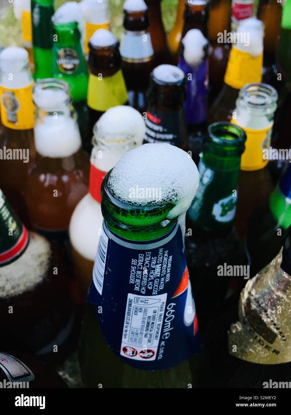 Lots of opened bottles of beer Stock Photo - Alamy