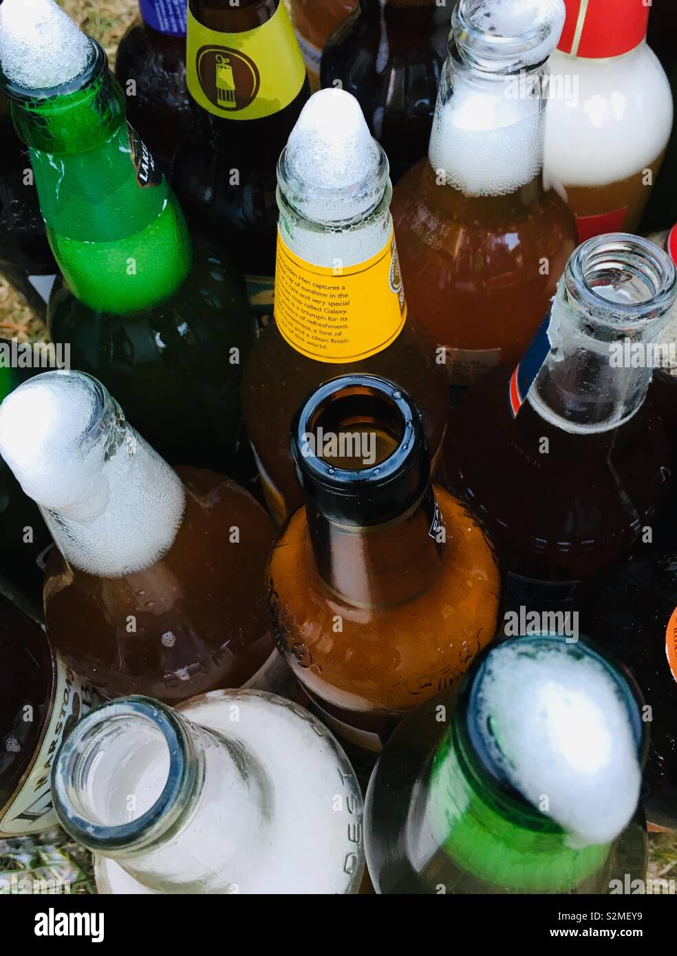 Lots of opened bottles of beer Stock Photo - Alamy