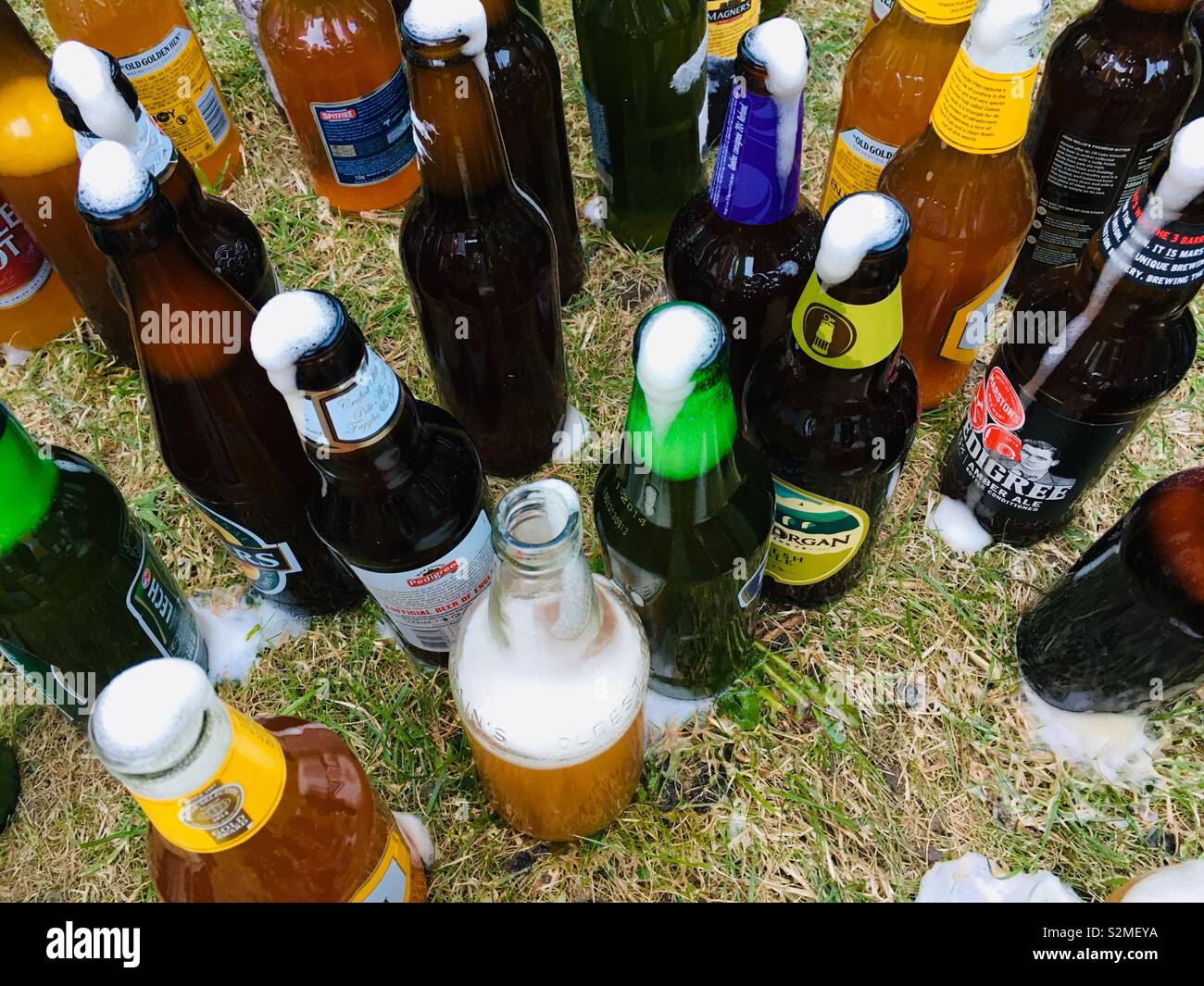 Lots of opened bottles of beer Stock Photo - Alamy