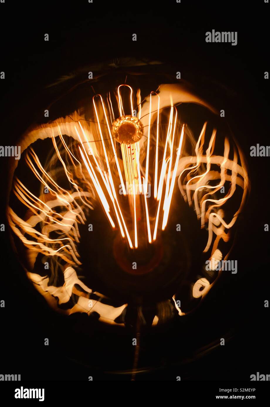 Illuminated filaments of a light bulb Stock Photo - Alamy