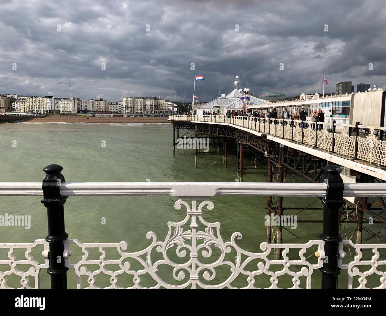 View from Brighton pier towards the waterfront on a late April day with ...