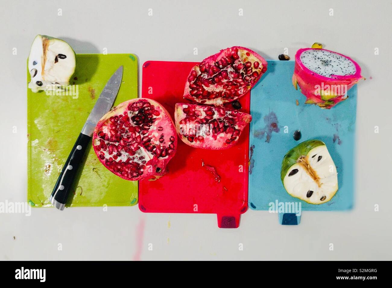 Exotic fruits on messy cutting boards Stock Photo - Alamy