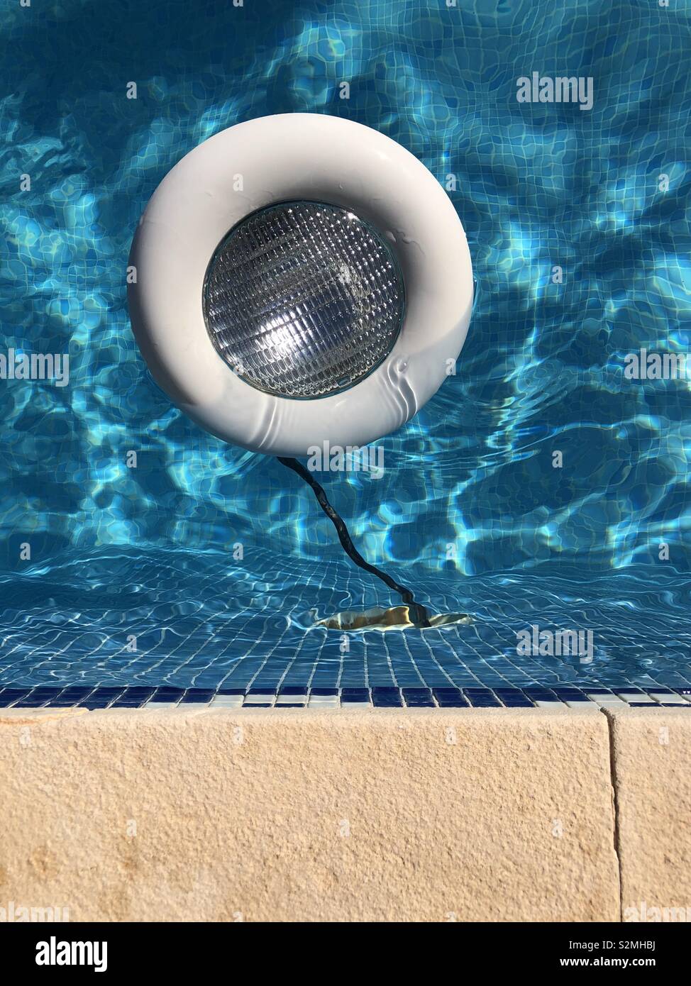 Pool light floating in swimming pool Stock Photo - Alamy