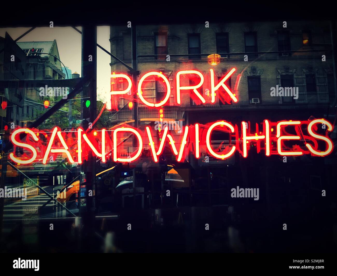 Pork sandwiches bright red neon on a restaurant in Manhattan, NYC, USA ...