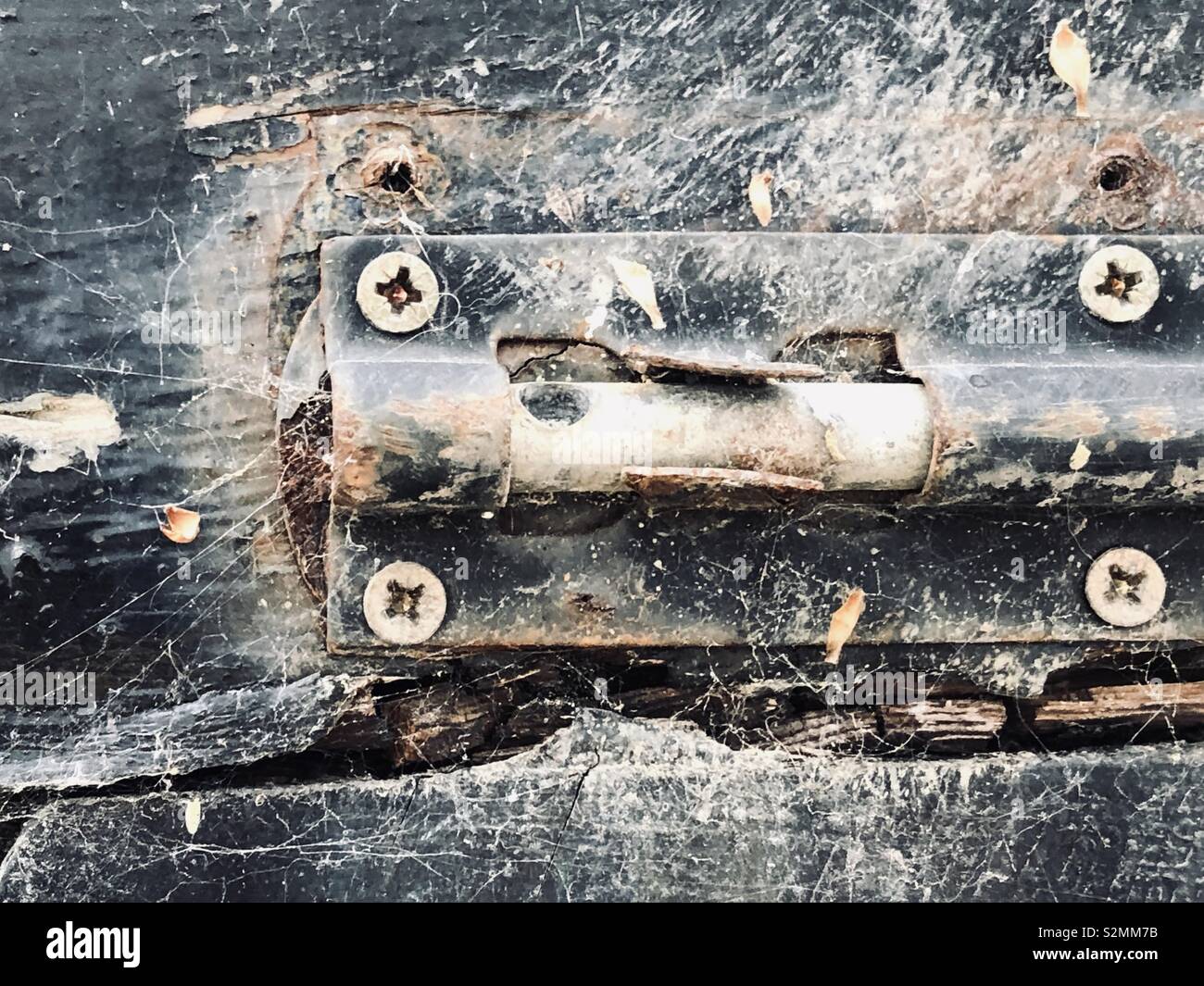 Rusty metal catch Stock Photo - Alamy