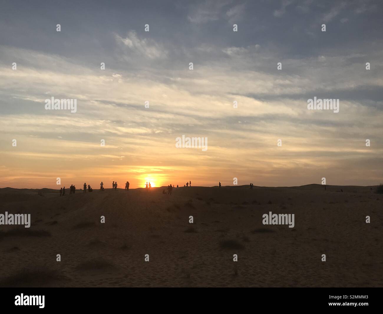 Sunset at the desert Stock Photo - Alamy