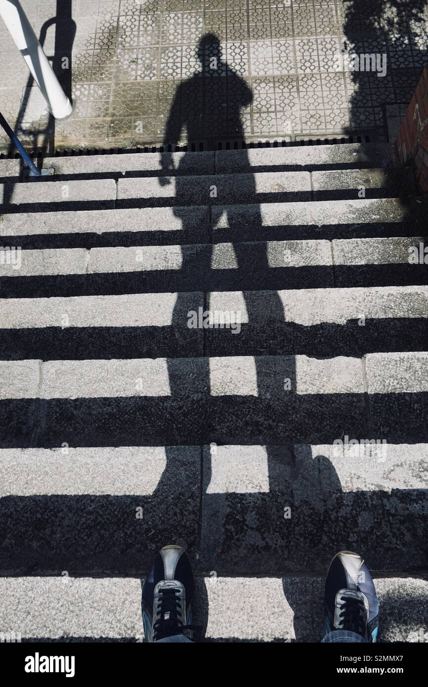 Shadow man stairs hi-res stock photography and images - Alamy