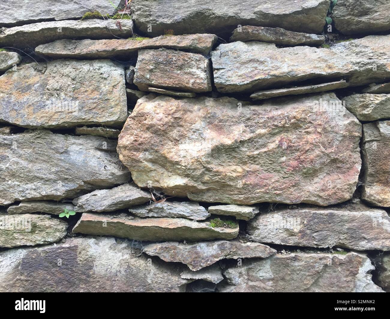 Full frame natural stone wall texture Stock Photo - Alamy
