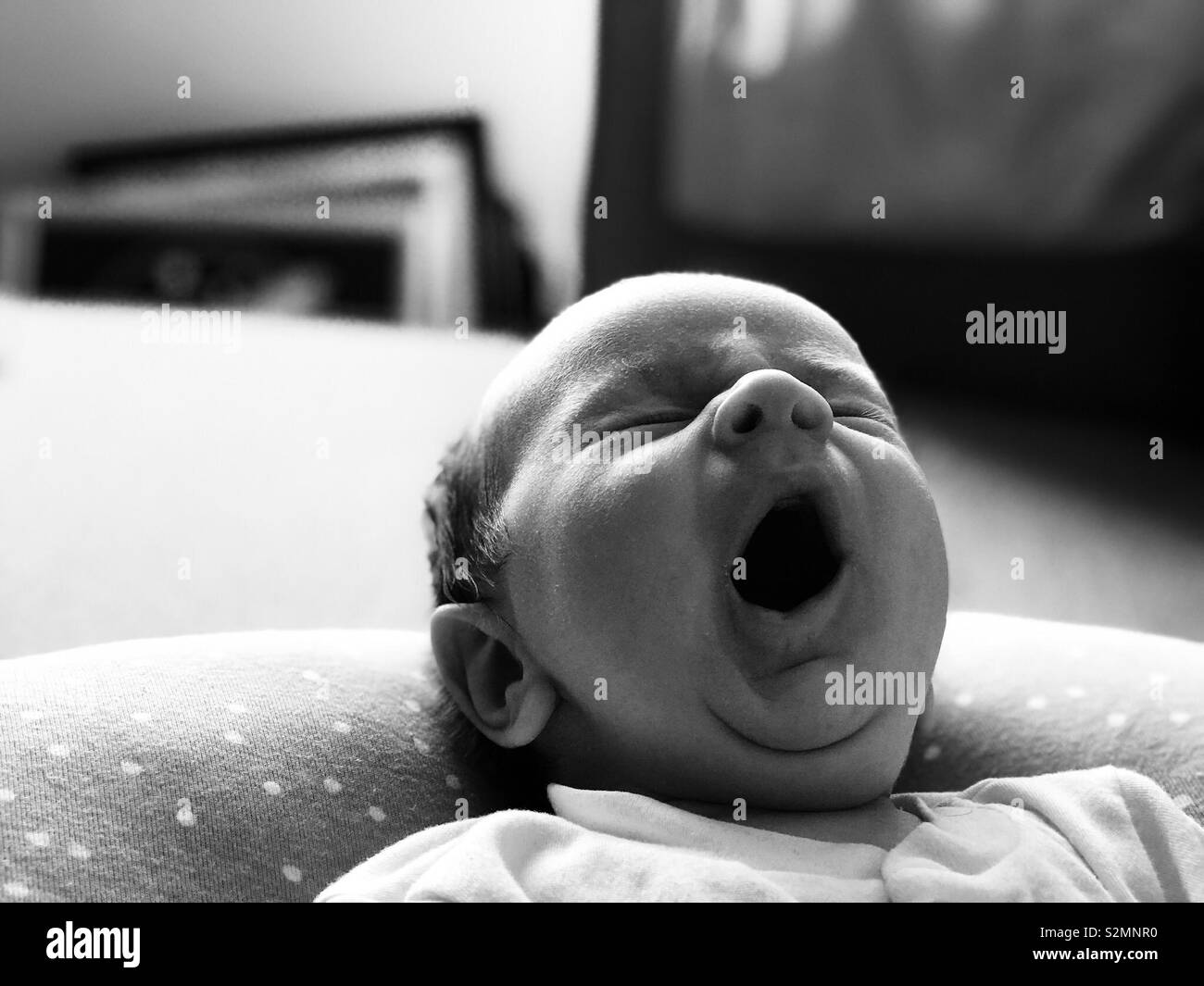 Yawning newborn baby Stock Photo - Alamy