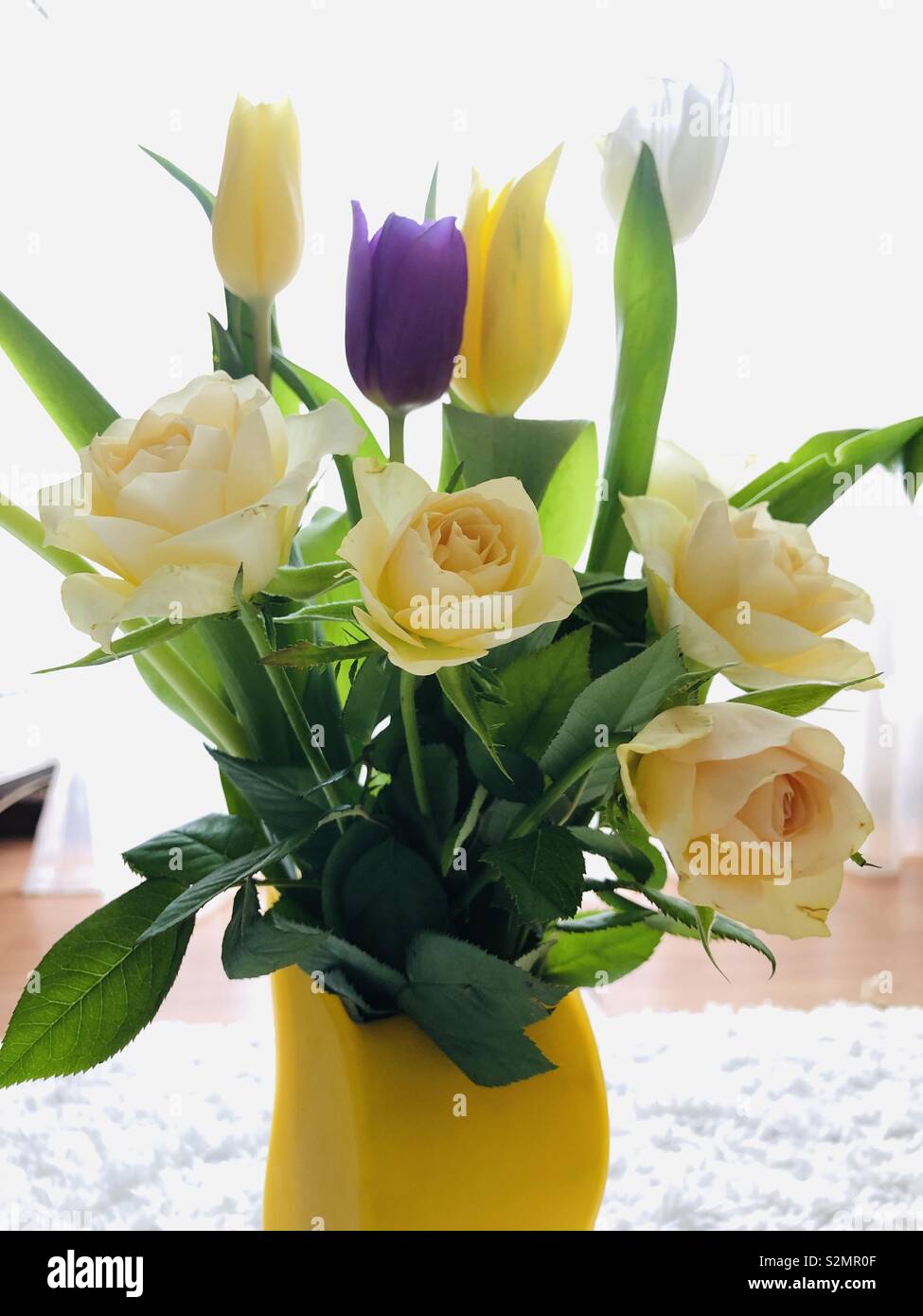 Beautiful bouquet of roses and tulips Stock Photo - Alamy