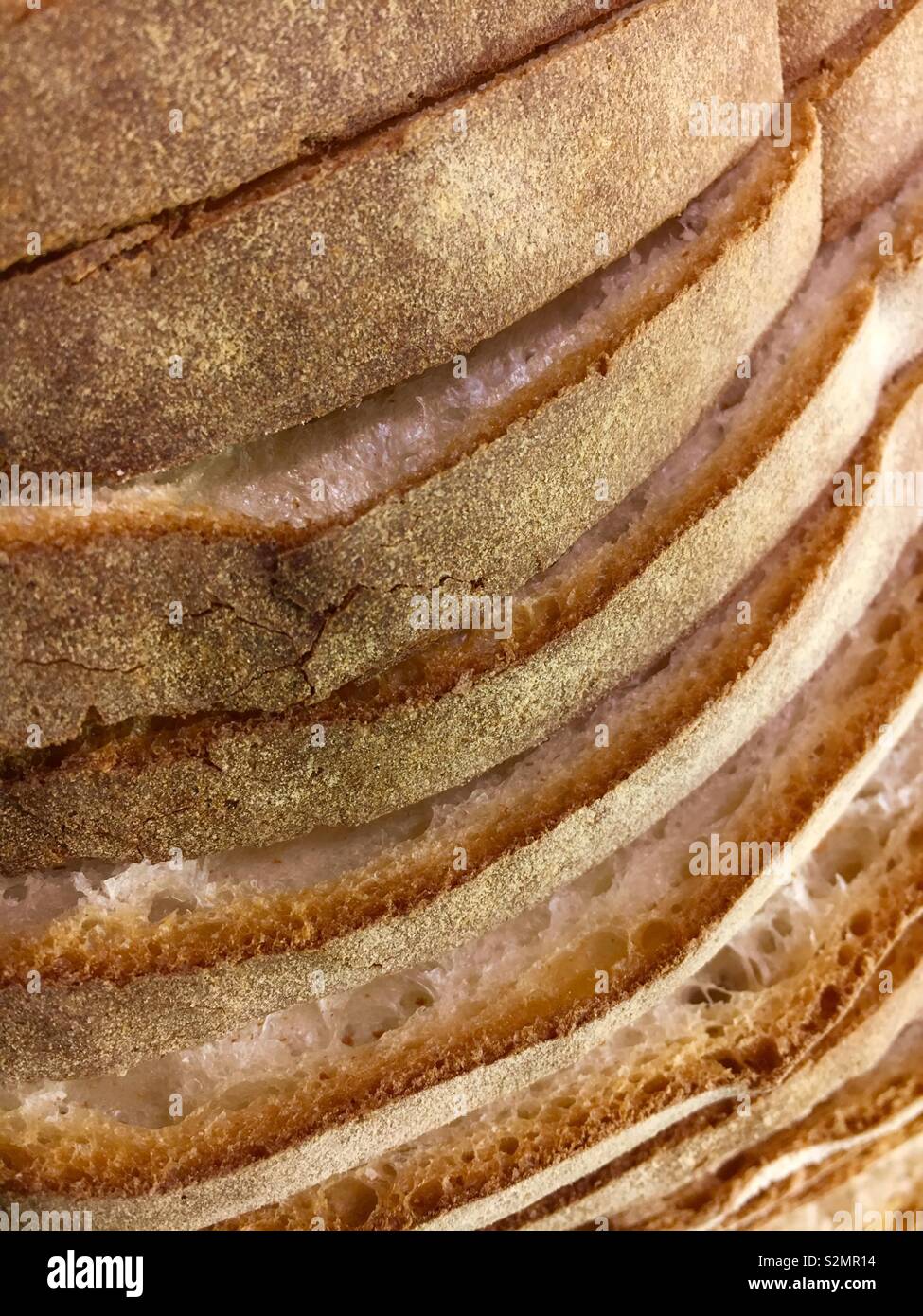 Close up of a freshly baked crusty sliced loaf of bread Stock Photo - Alamy