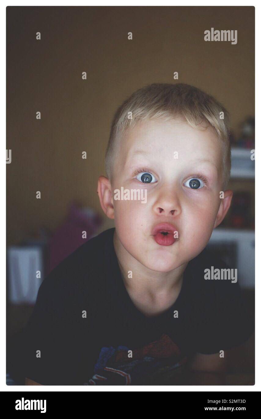 Boy with surprised face expression Stock Photo - Alamy