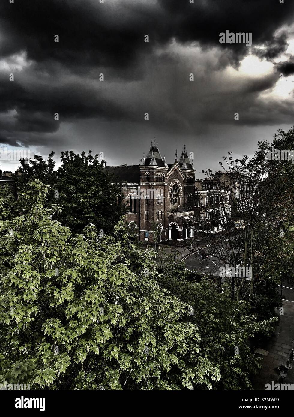 Dramatic clouds above an east London Church Stock Photo - Alamy