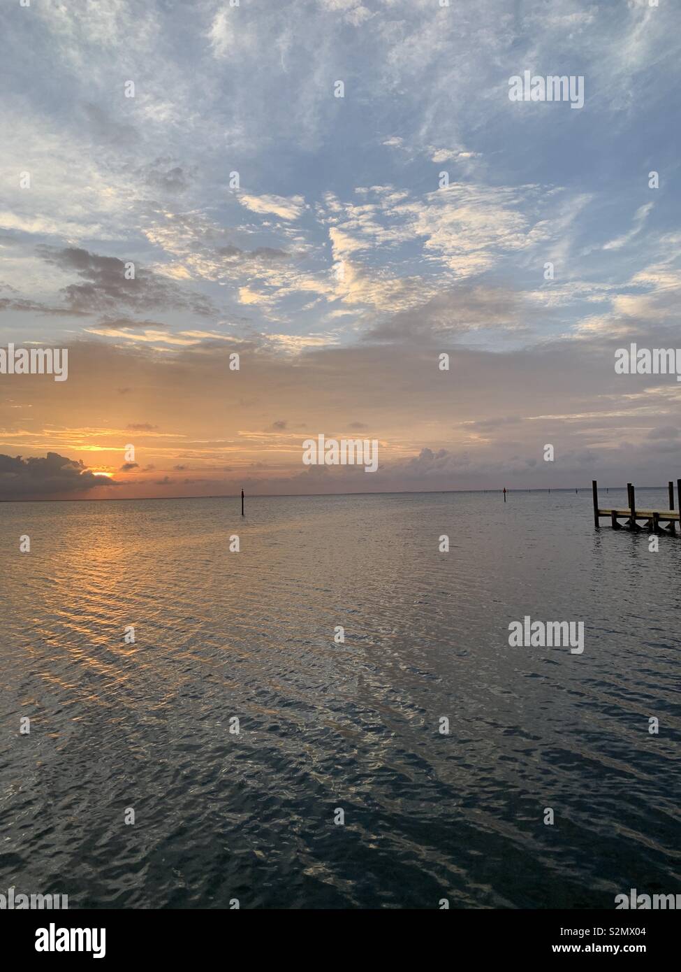 Sunset over bay Stock Photo - Alamy