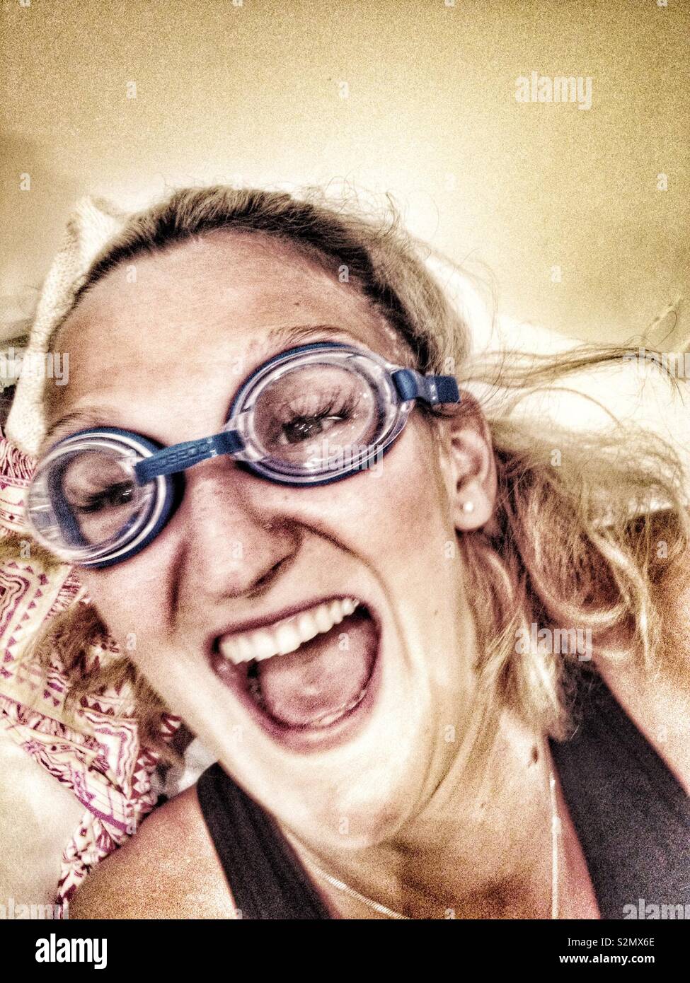 Girl pulling face Stock Photo - Alamy