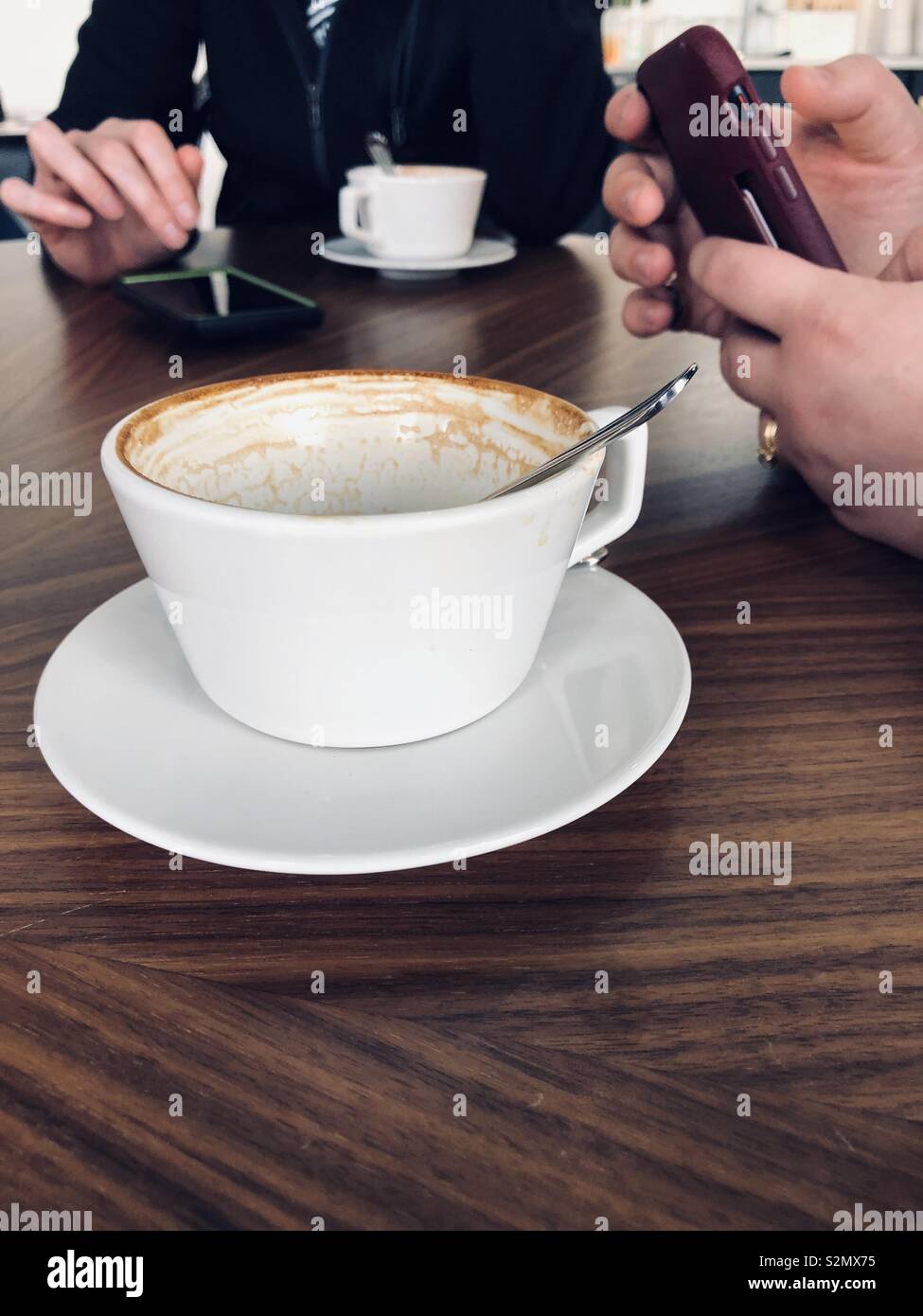 Coffee time conversation with friends on a lazy overcast day Stock ...