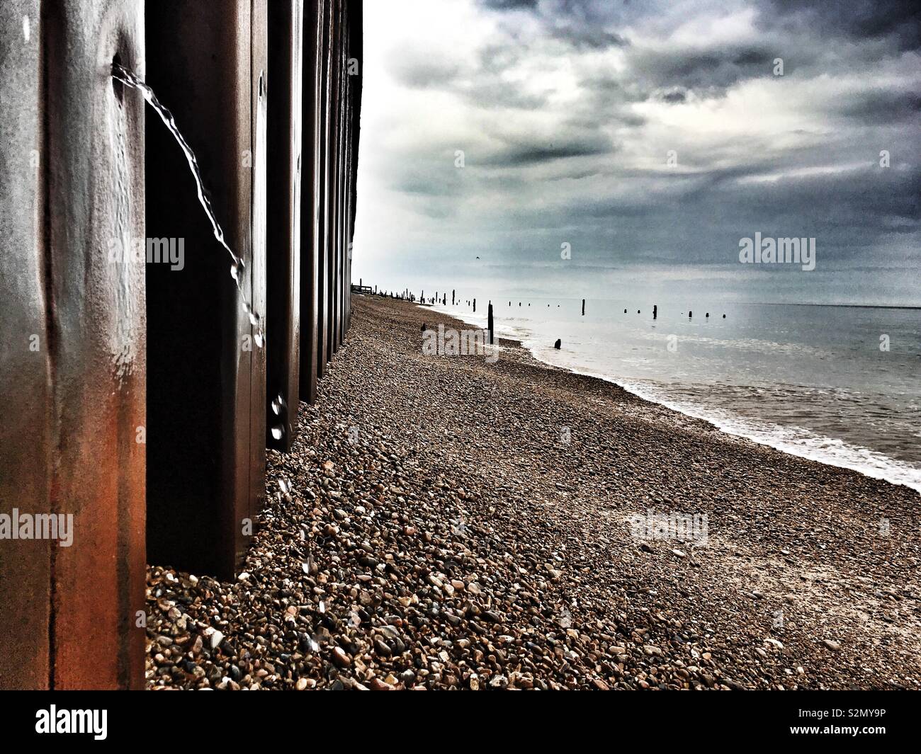 Water pouring from hole in a sea wall hi-res stock photography and ...