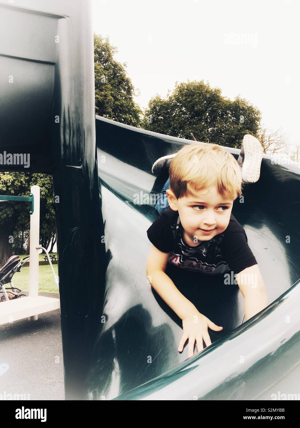 Child on the slide hi-res stock photography and images - Alamy