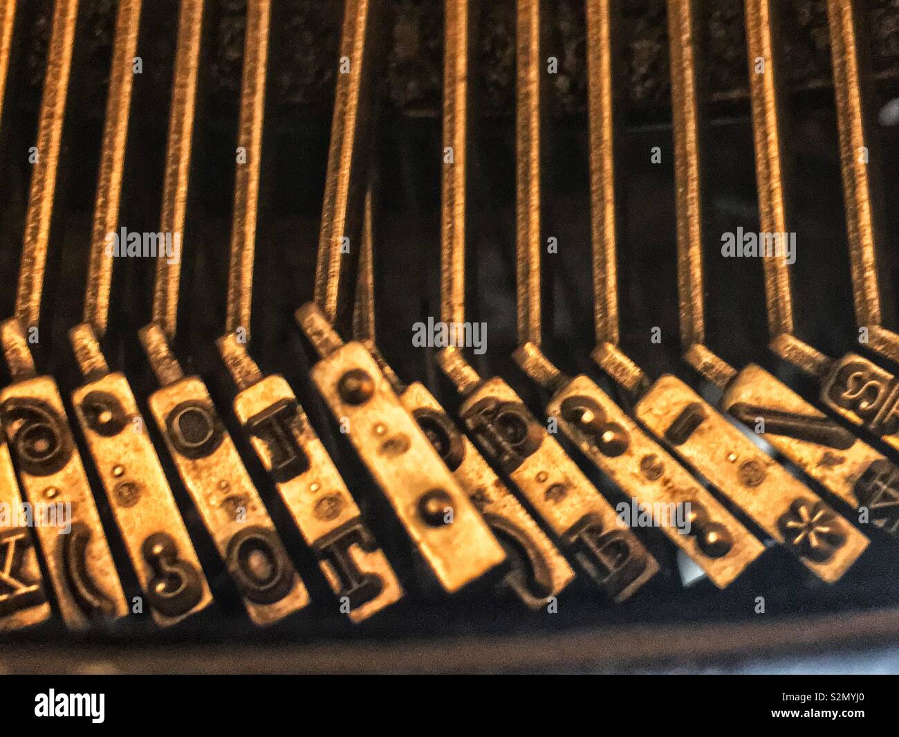 Soft focus Closeup of letter printing keys in an antique typewriter ...