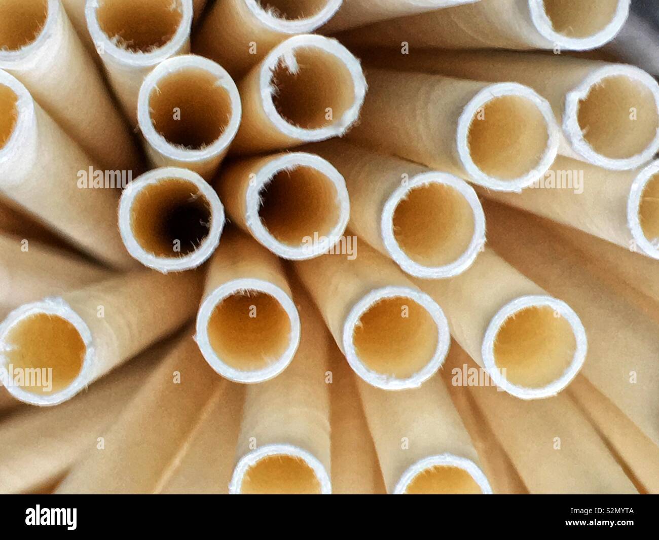 Full frame closeup of the top view of a bunch of paper straws that are ...