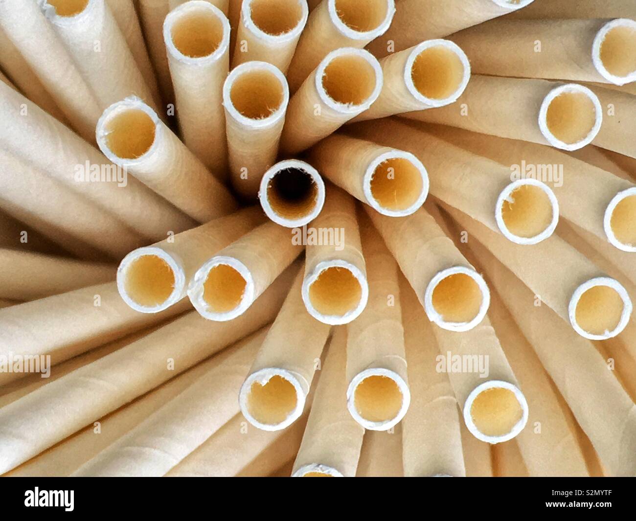 Full frame closeup of the top view of a bunch of paper straws that are ...