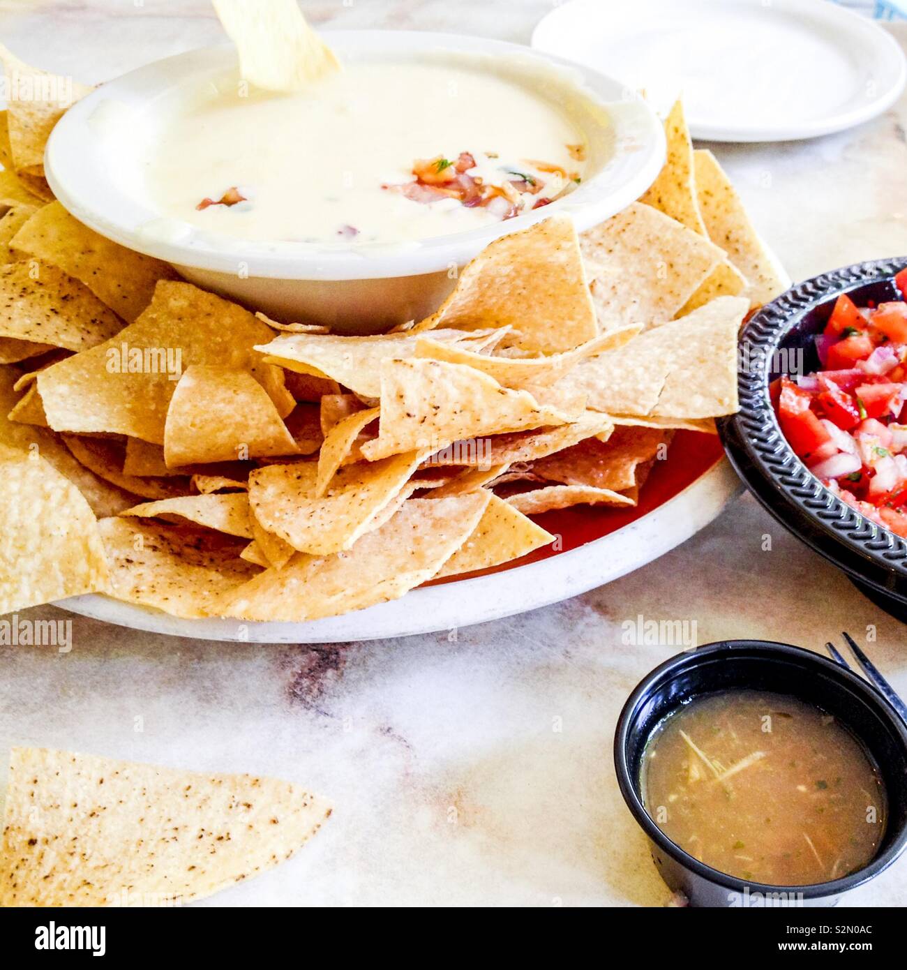 Chips and quest cheese dip Stock Photo - Alamy