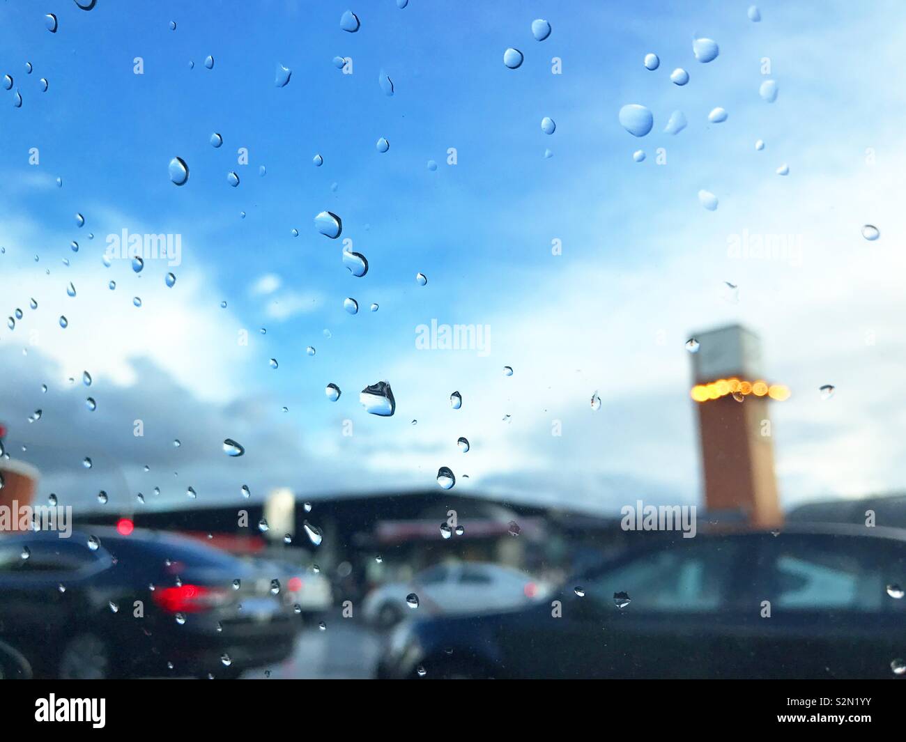 Traffic viewed through a wet glass Stock Photo - Alamy