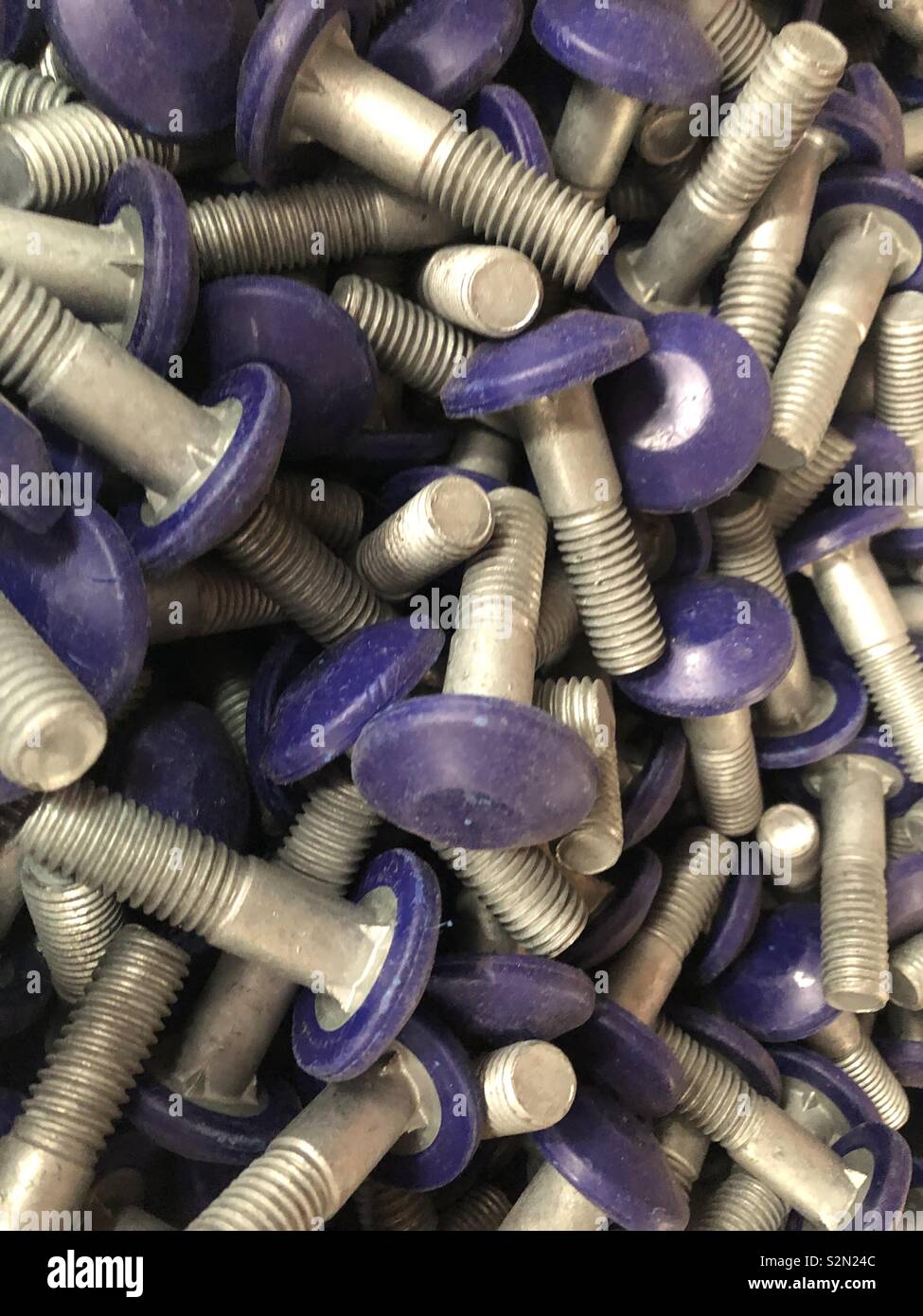 Purple plastic coated bolts Stock Photo - Alamy