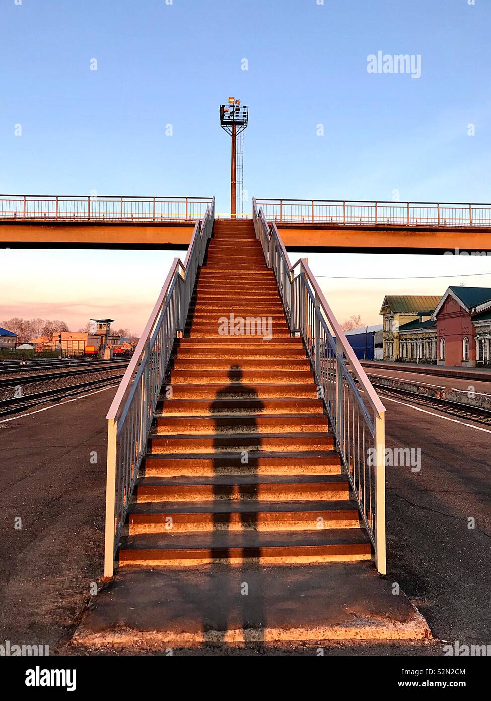 Sunset railway crossing Stock Photo - Alamy