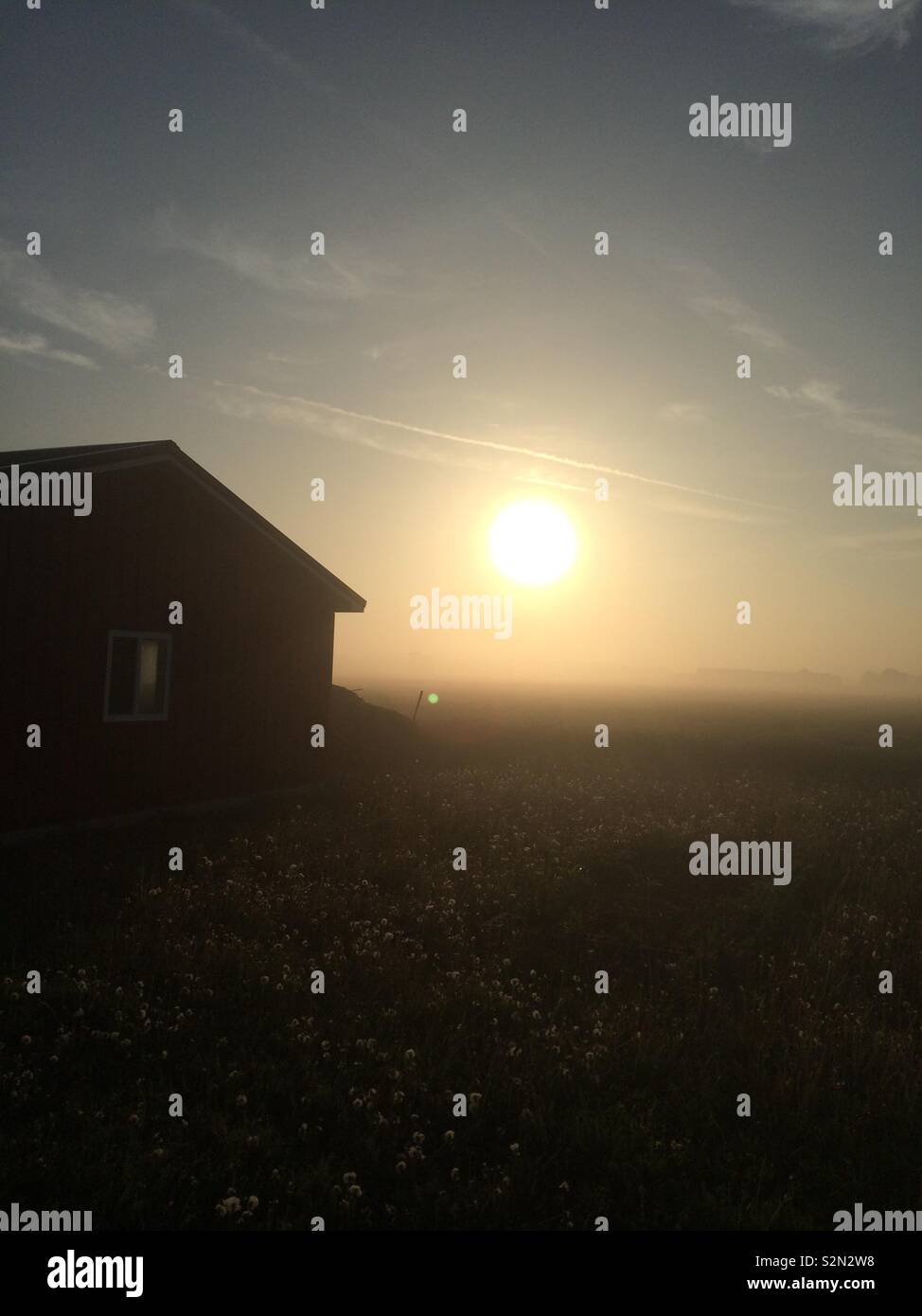 Farm at sunrise Stock Photo - Alamy