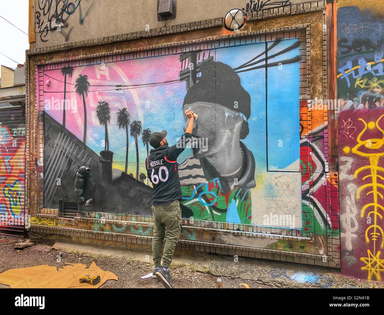 Artist at work in Graffiti Alley, Toronto, Canada Stock Photo - Alamy