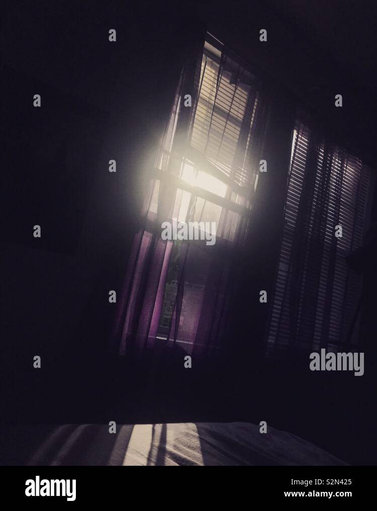 Morning sun seeping through window Stock Photo - Alamy
