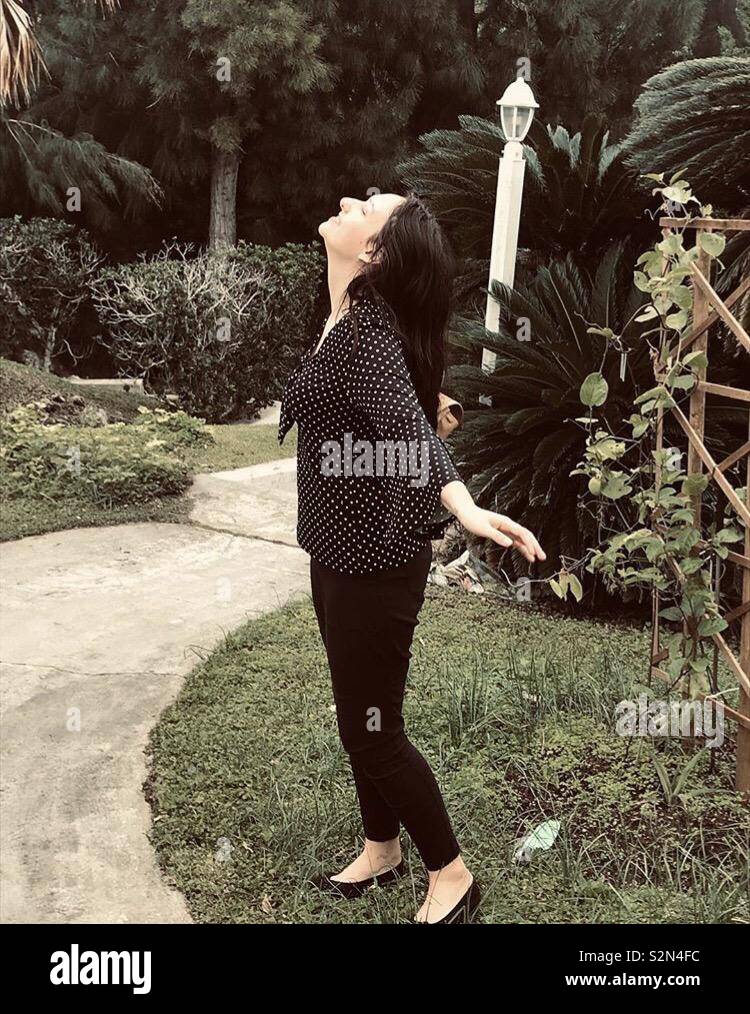 Lady dancing in garden Stock Photo - Alamy