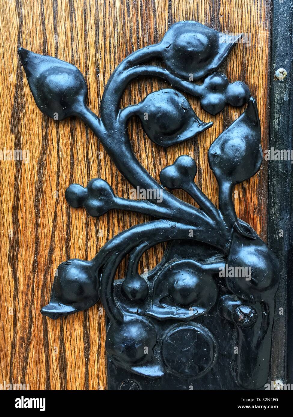 Super fancy and ornate door hinge Stock Photo - Alamy