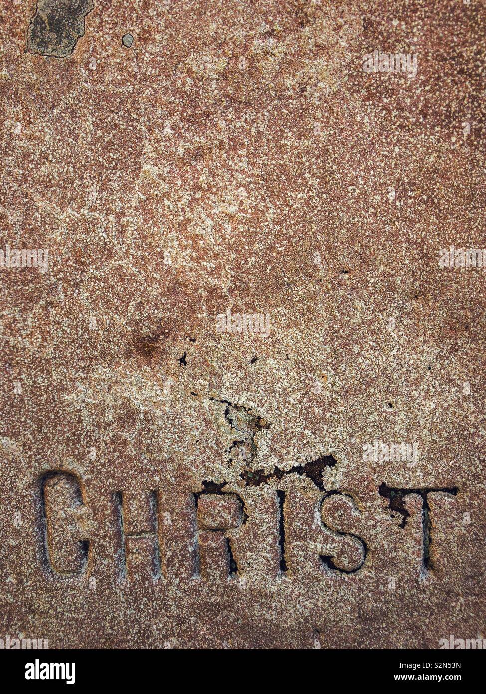 The word Christ engraved on an old gravestone Stock Photo - Alamy