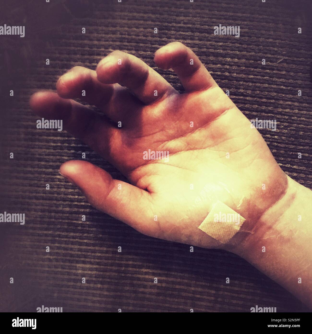 Boy hand with a plaster Stock Photo - Alamy
