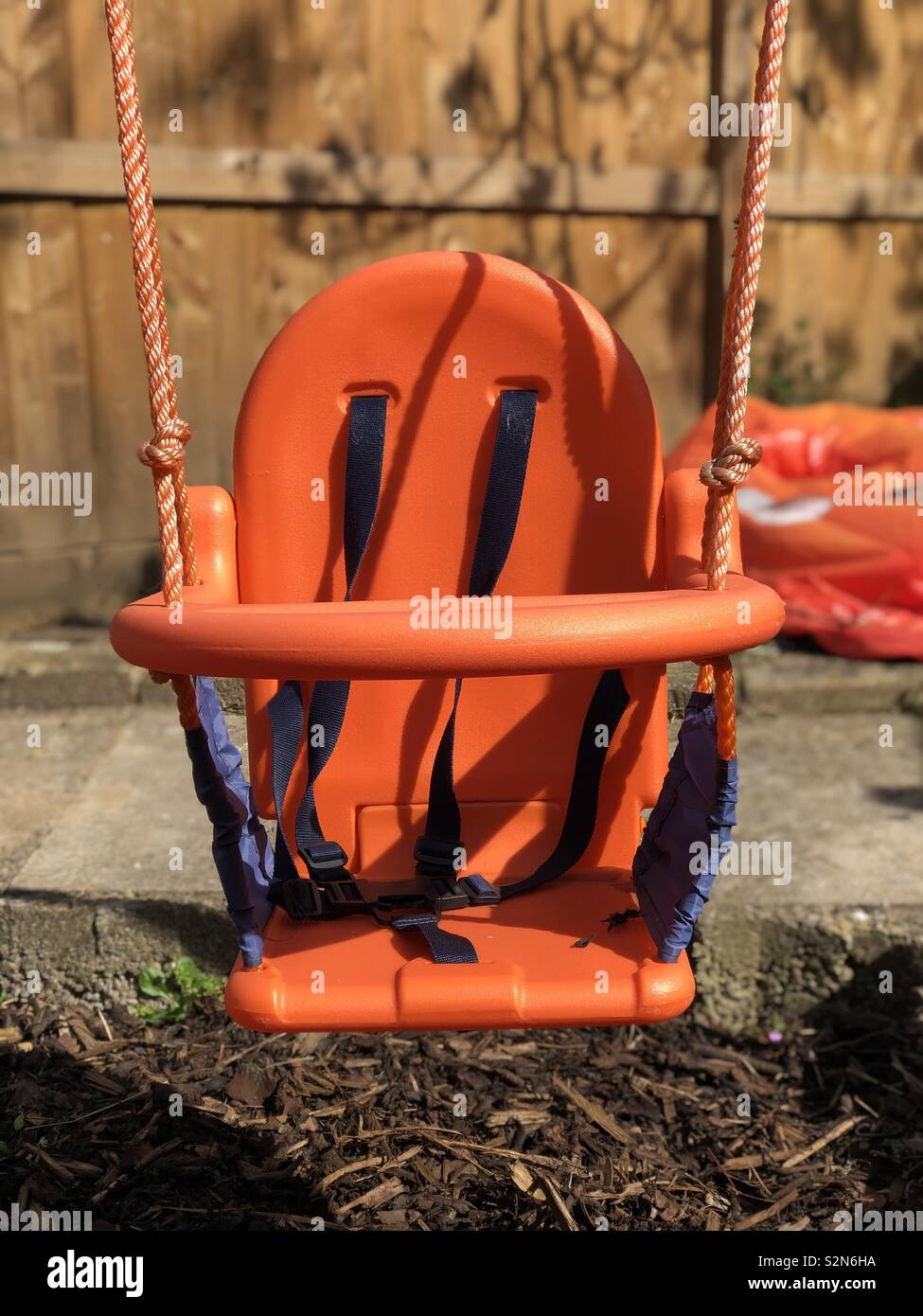 Orange swing at a standstill Stock Photo - Alamy