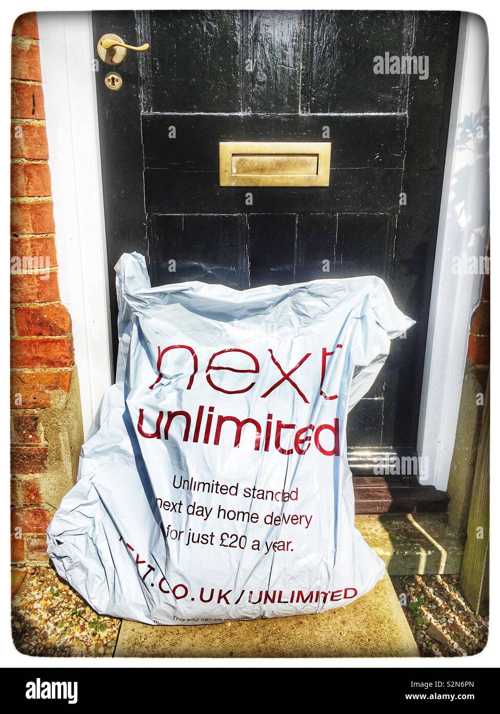Next package left on doorstep Stock Photo - Alamy
