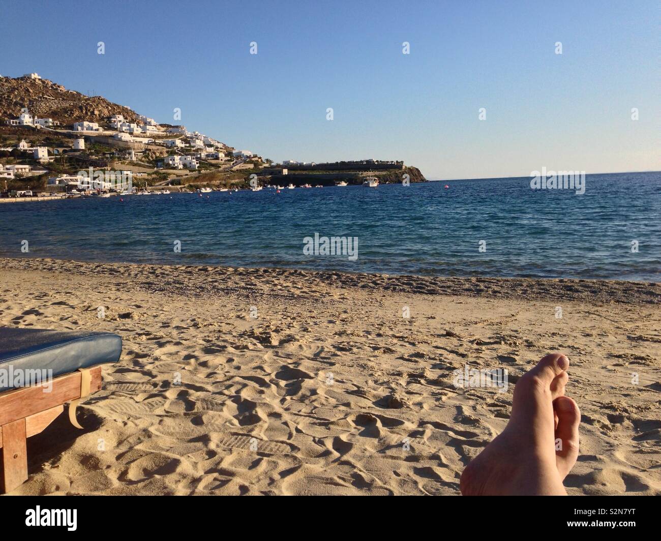 Relaxing at the beach in Mykonos, Greece Stock Photo - Alamy