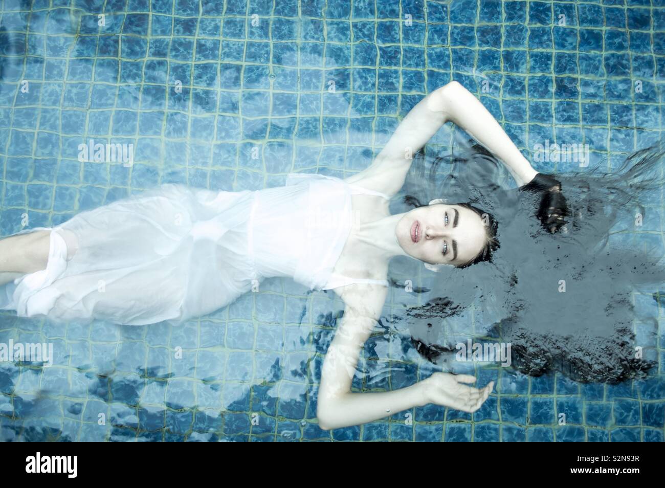 Beautiful model in a swimming pool Stock Photo - Alamy