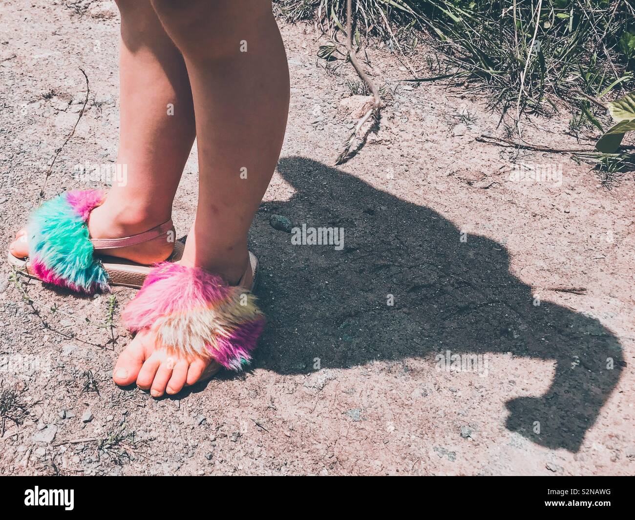 Summer photo of little girl’s legs, feet, and shadow- with multicolored ...